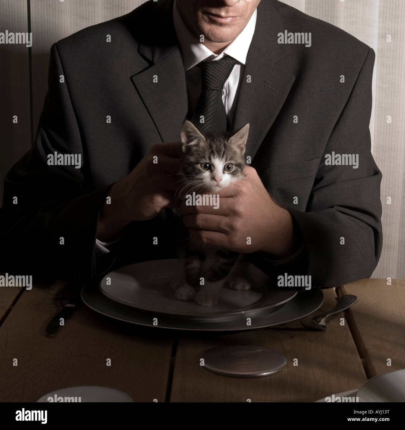 Friend or food?-Man with cat! Stock Photo - Alamy