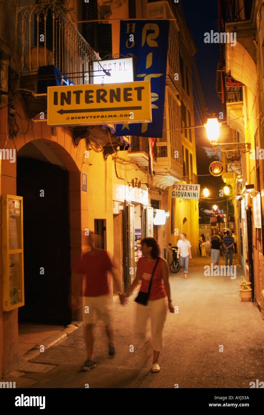 Palma Nightlife couple walking through the narrow old streets of Palma ...