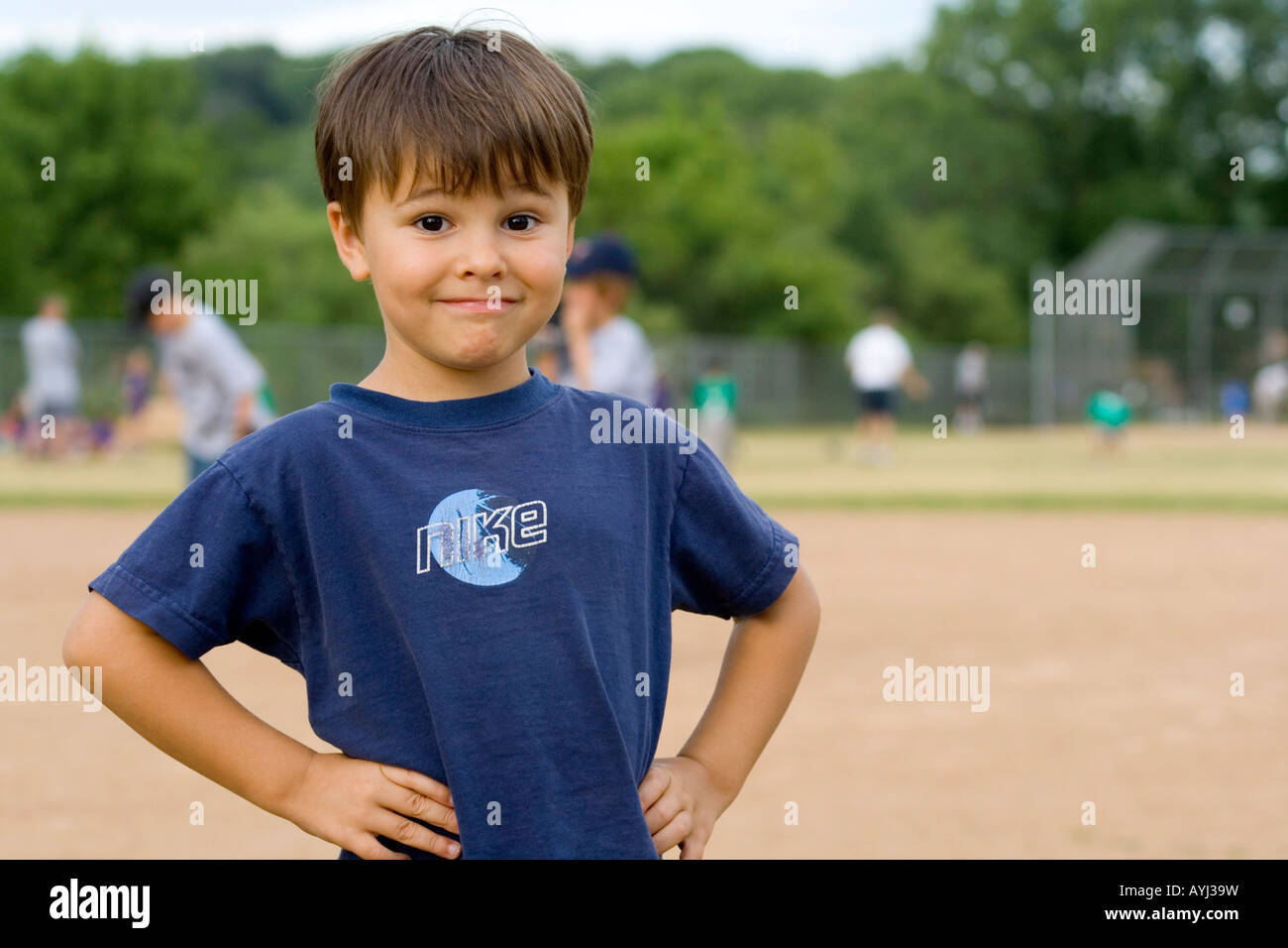 Portrait of determined boy age 4 at baseball game. Homecroft School ...
