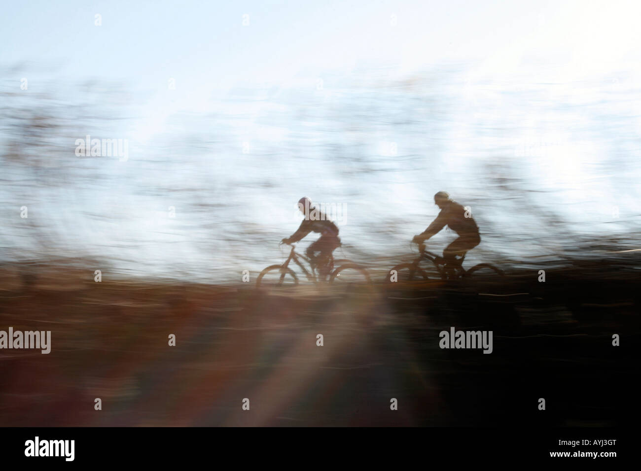two people riding fast bike in countryside Stock Photo - Alamy