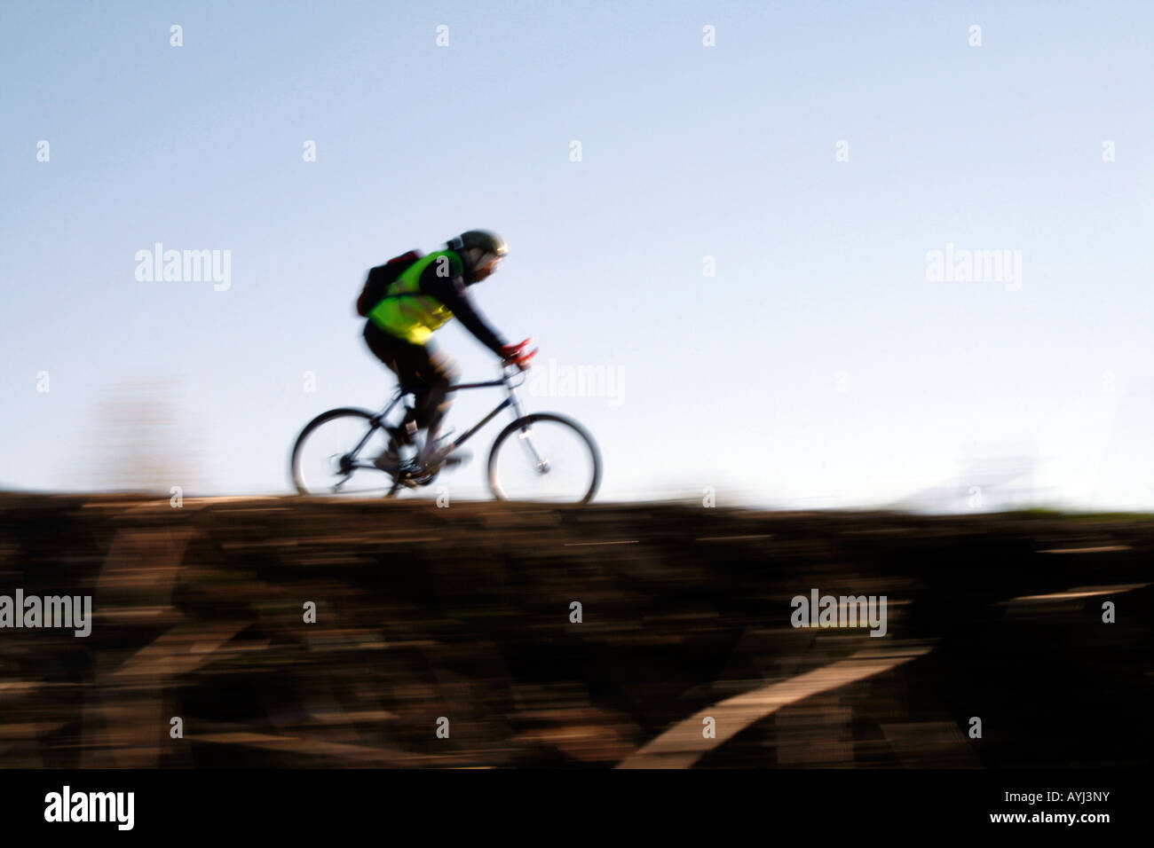 person riding fast bike in countryside Stock Photo - Alamy