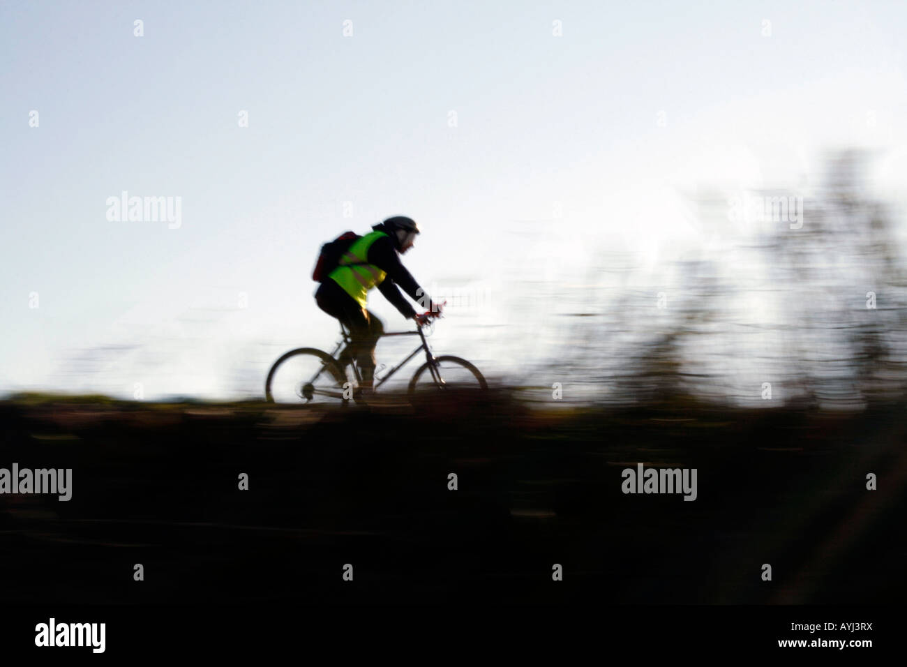 person riding fast bike in countryside Stock Photo - Alamy
