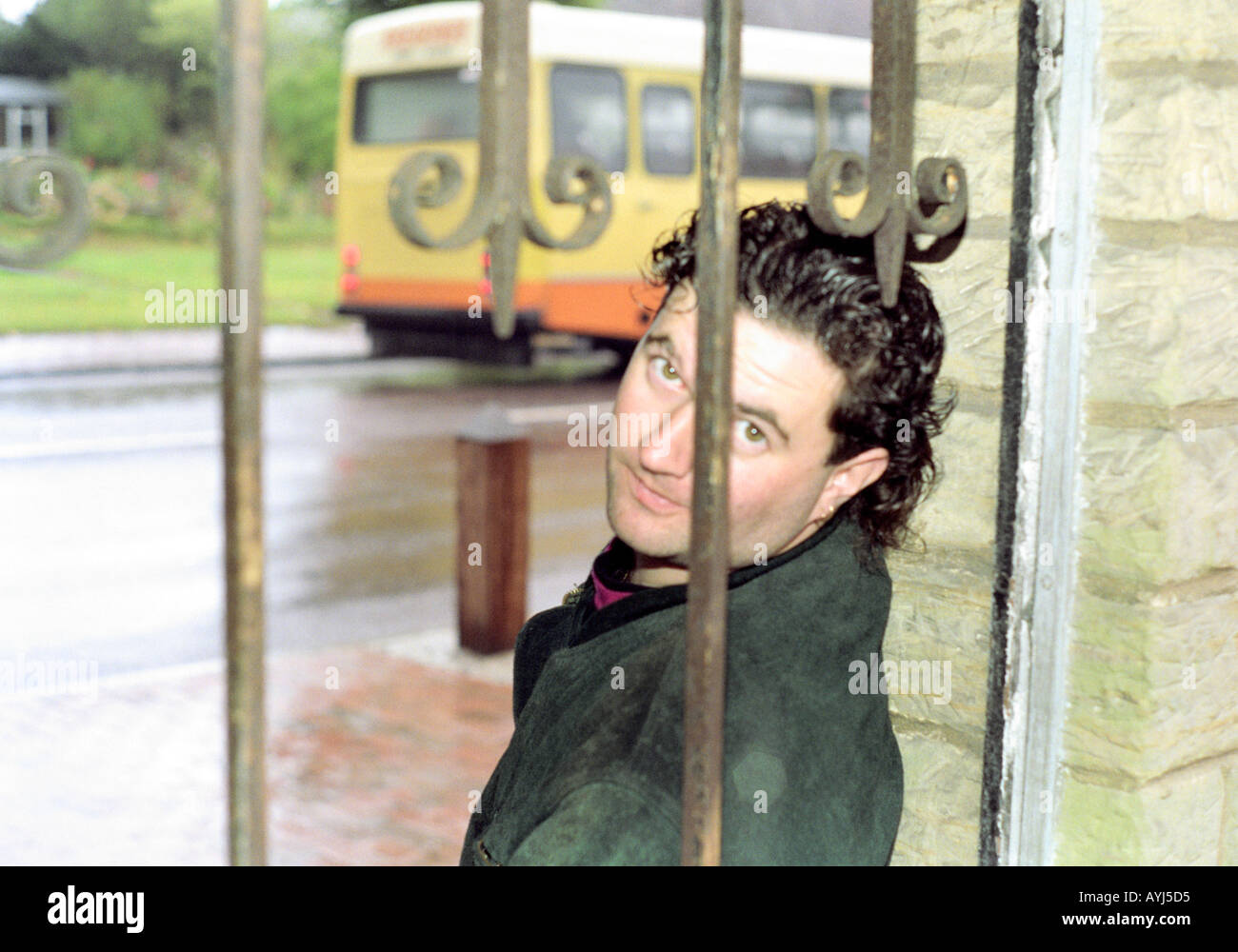 Behind bars at the bus stop Stock Photo - Alamy