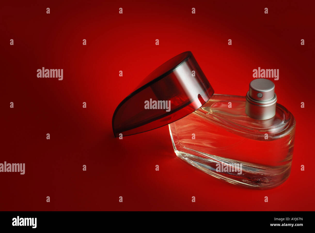 perfume A bottle perfume on a red background with effective ...