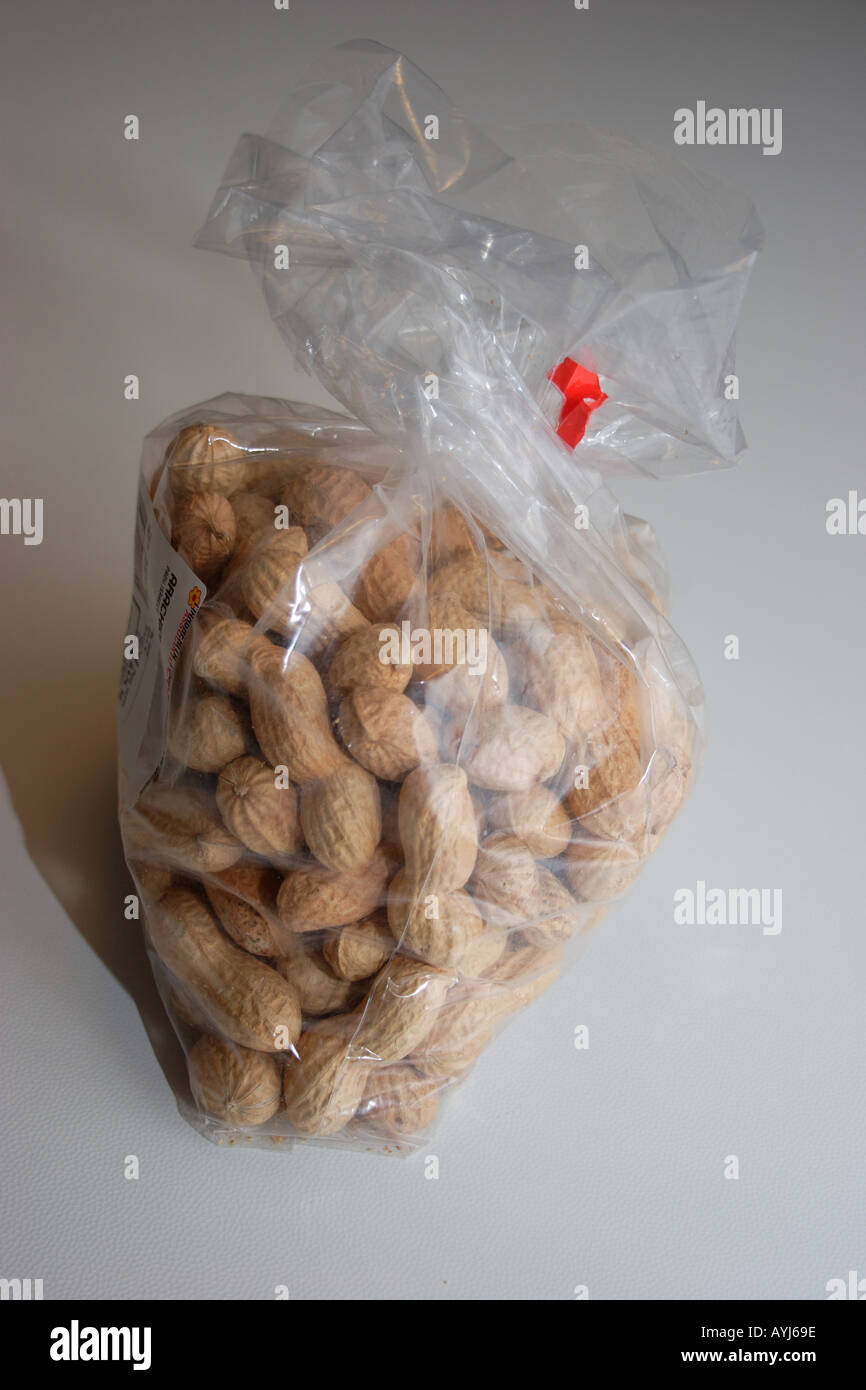 peanuts plastic bag transparent film eat food peanut Stock Photo - Alamy