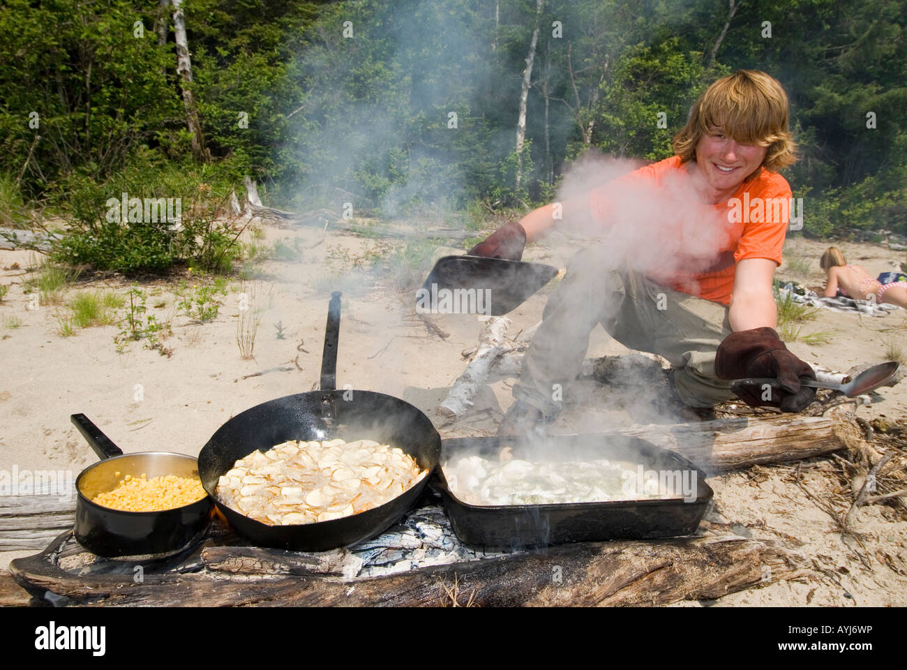 Guide cooking shore lunch Stock Photo - Alamy