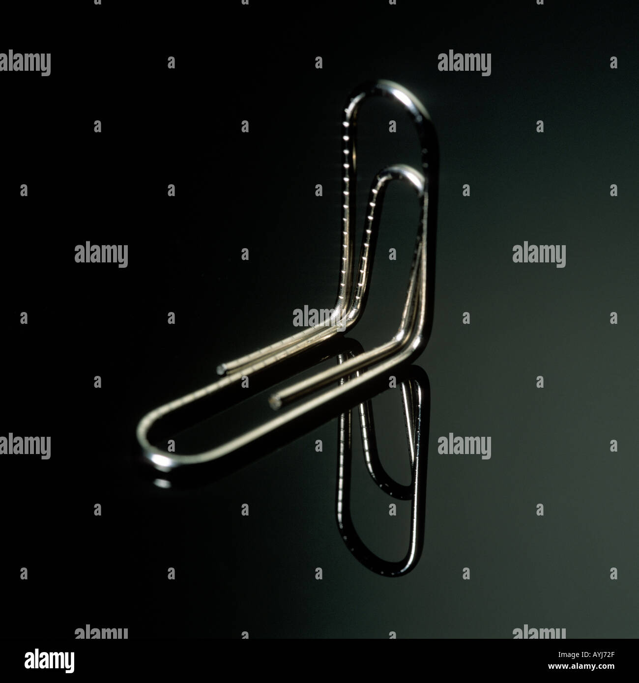 A bent paperclip Stock Photo - Alamy