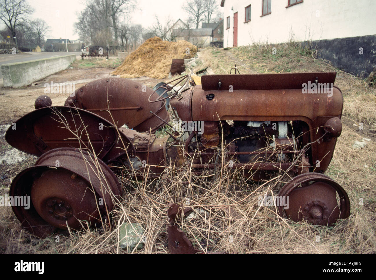 Old worn out and burned Tractor left by a careless Farmer Stock Photo ...