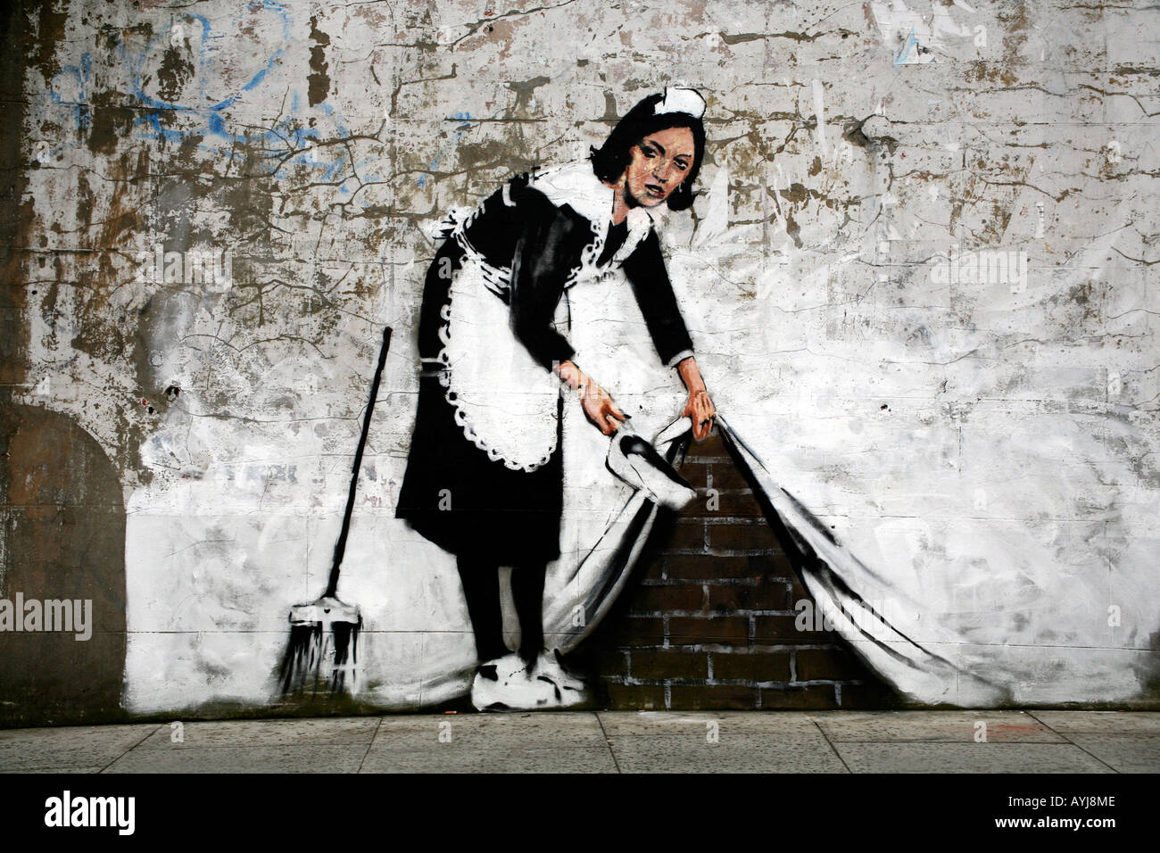 Banksy artwork titled Sweeping it Under the Carpet, Chalk Farm Stock ...