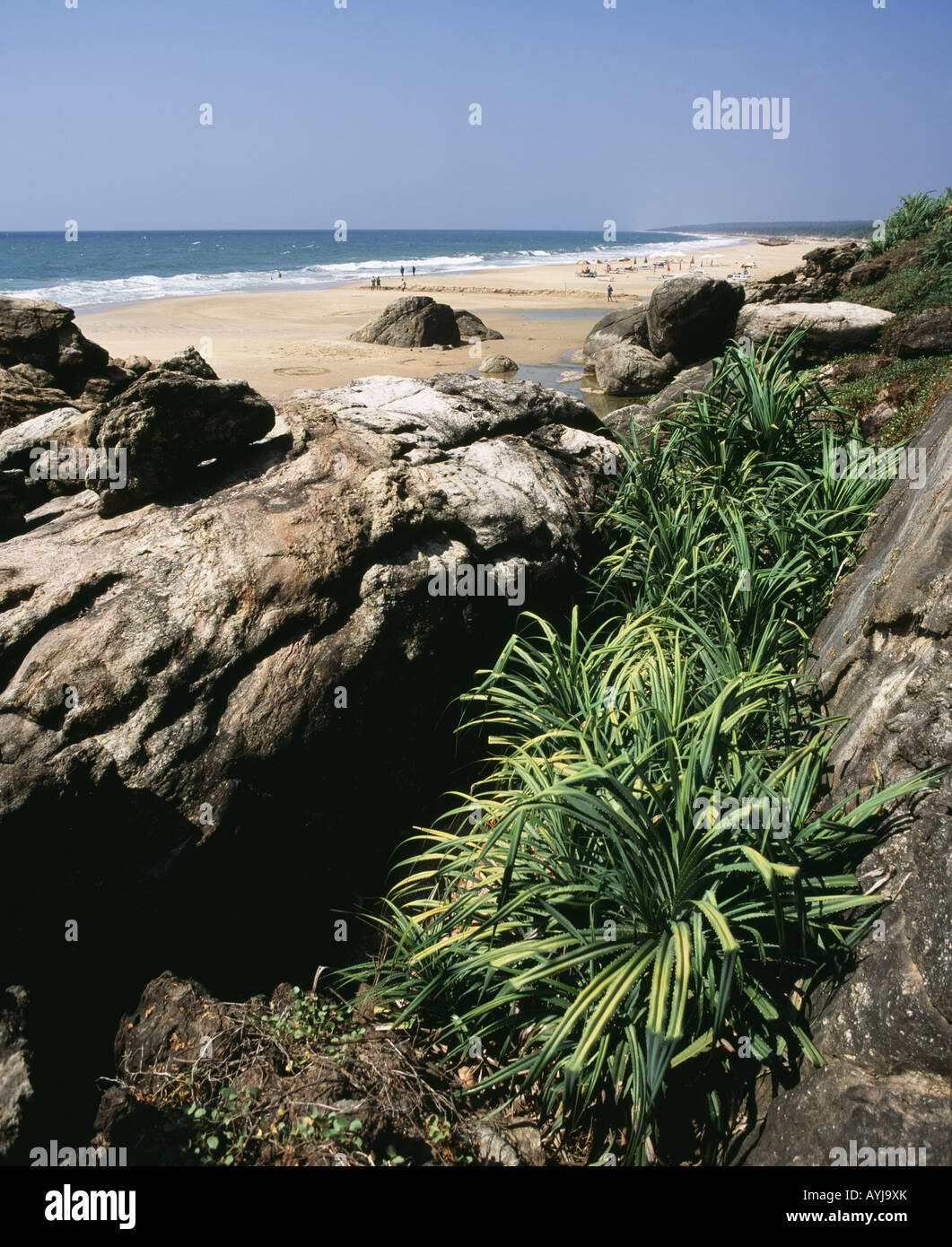 Chowara Beach Sand local fishing boats Sunbeds People Sea waves Rocks ...