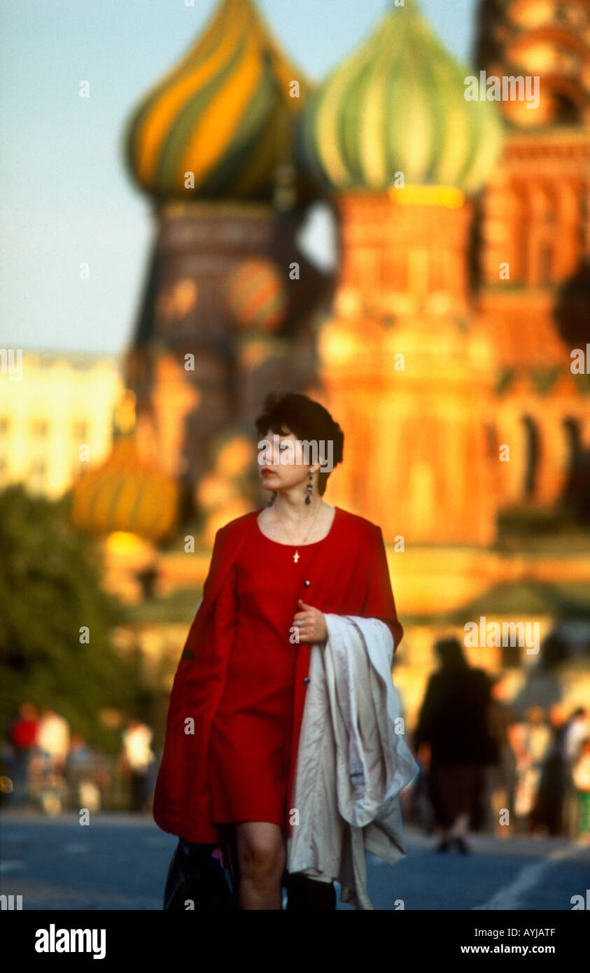 Russian woman in a red dress against background of St Basil s Cathedral ...