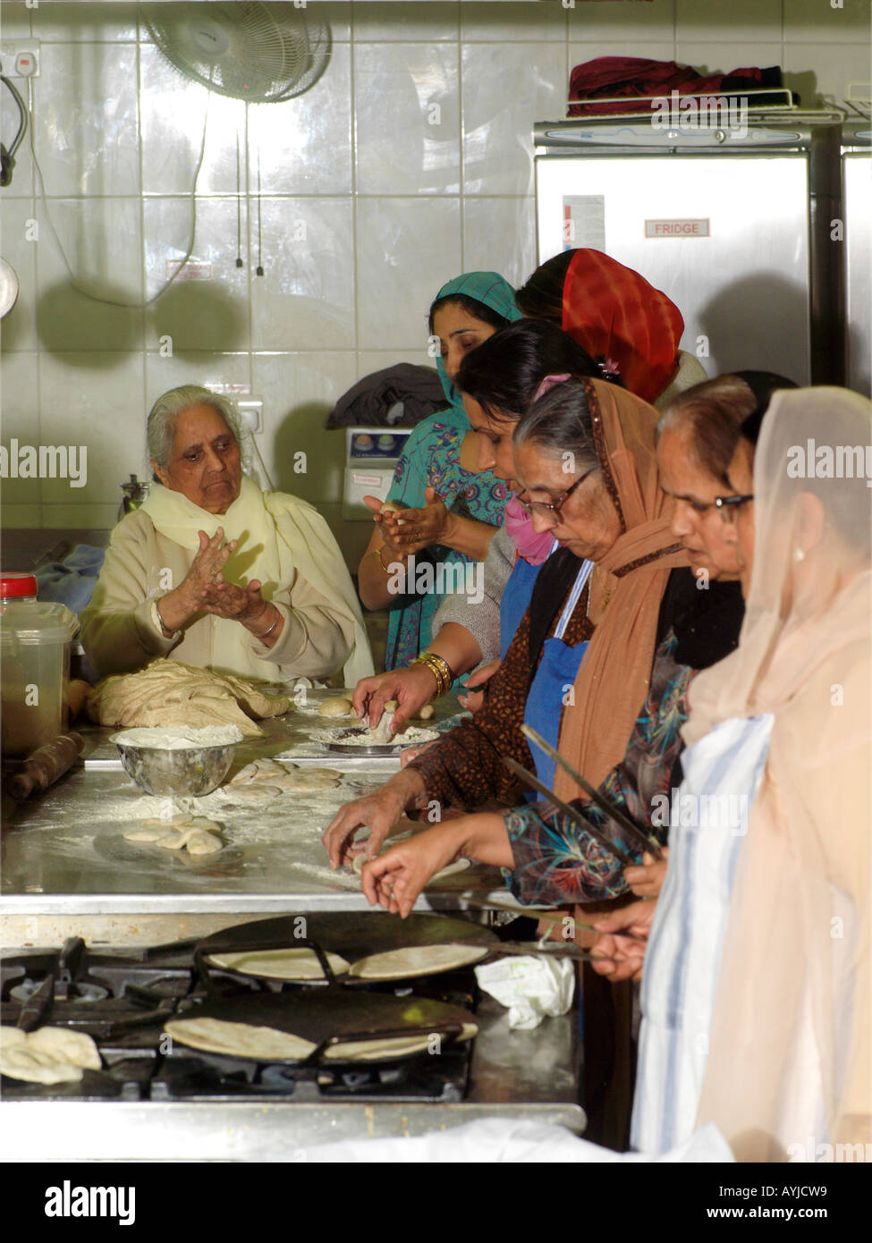 Khalsa Centre Tooting London England Women Making Chapatis in Kitchen ...