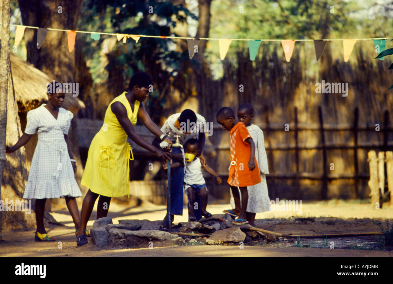 Zambia Shanty Town Water Tap - Child Drinking Stock Photo - Alamy