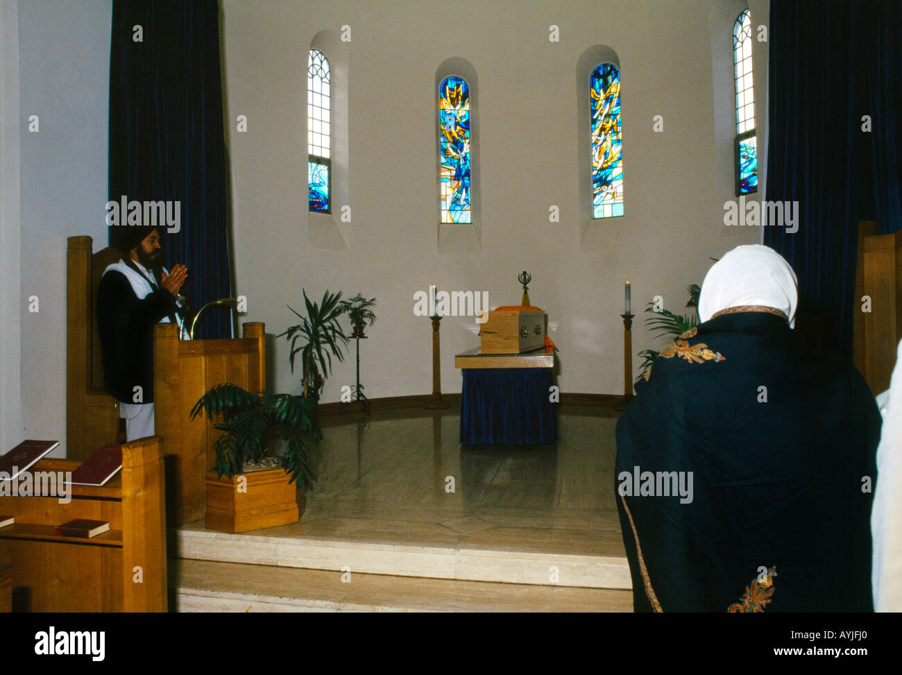 Sikh Funeral Service in Crematorium with Coffin and Granthi Stock Photo ...
