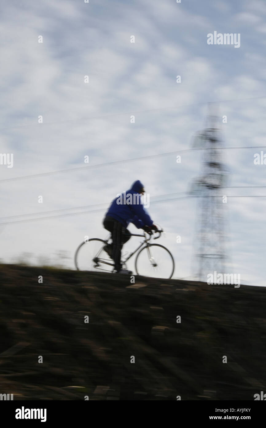 person riding fast bike in countryside Stock Photo - Alamy