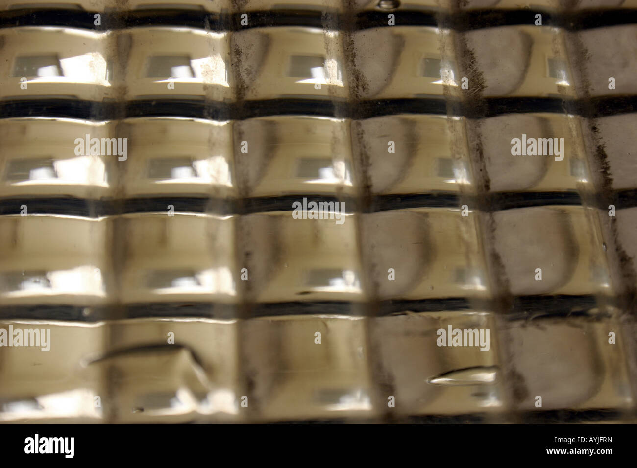 Close up of a glass block viewing a sun lite exterior Stock Photo - Alamy