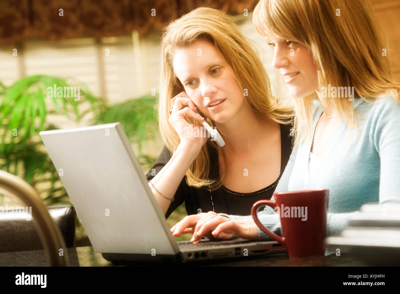Women on the phone and computer Stock Photo - Alamy