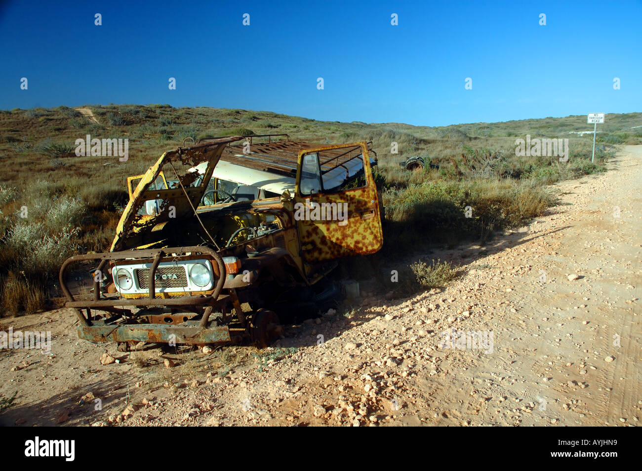 Wrecked old Toyota Landcruiser beside the road in Australia's outback ...