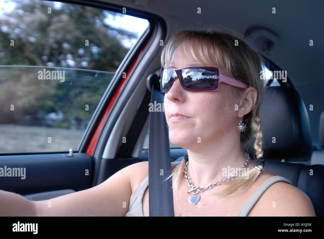 Woman driving car british hi-res stock photography and images - Alamy