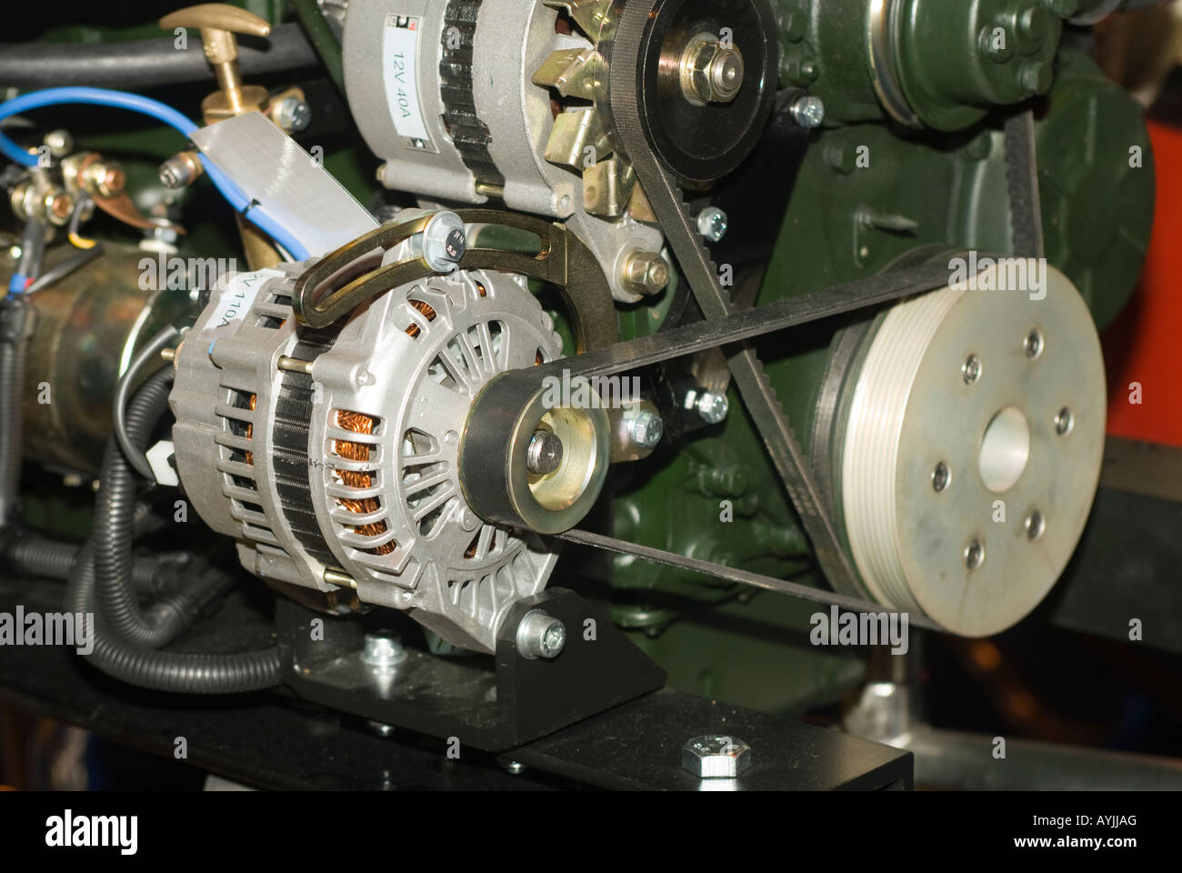 close up detail of a vehicle engine showing alternator Stock Photo - Alamy