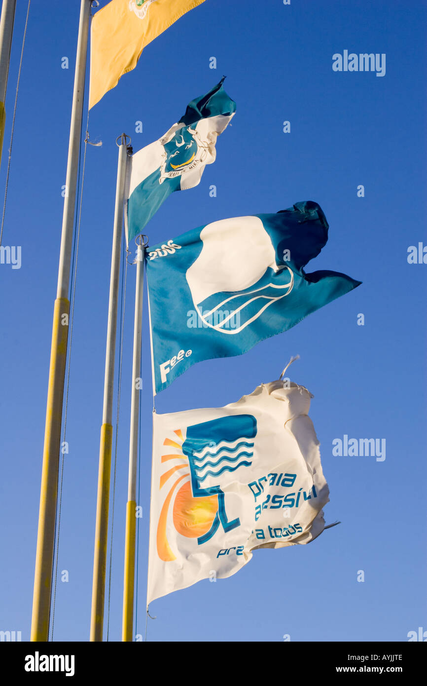 Flags flying on beach Praia de Mira Portugal Stock Photo - Alamy