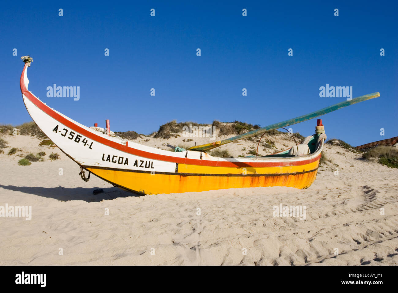 Colourful traditional fishing boat on beach Praia de Mira Portugal ... Colourful traditional fishing boat on beach Praia de Mira Portugal ...