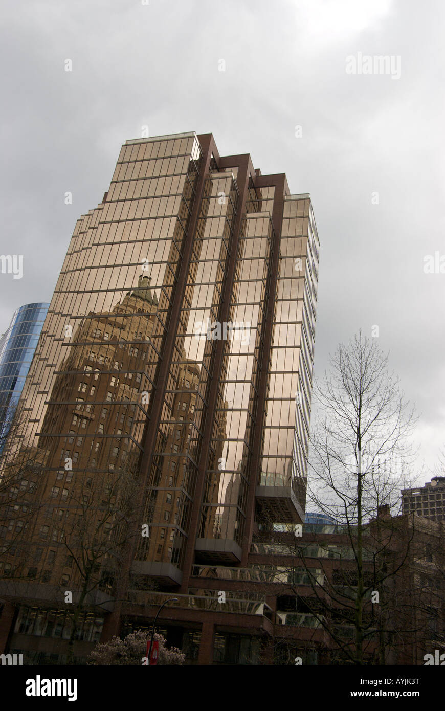 Reflection of the art deco Marine Building in one of the glass high ...