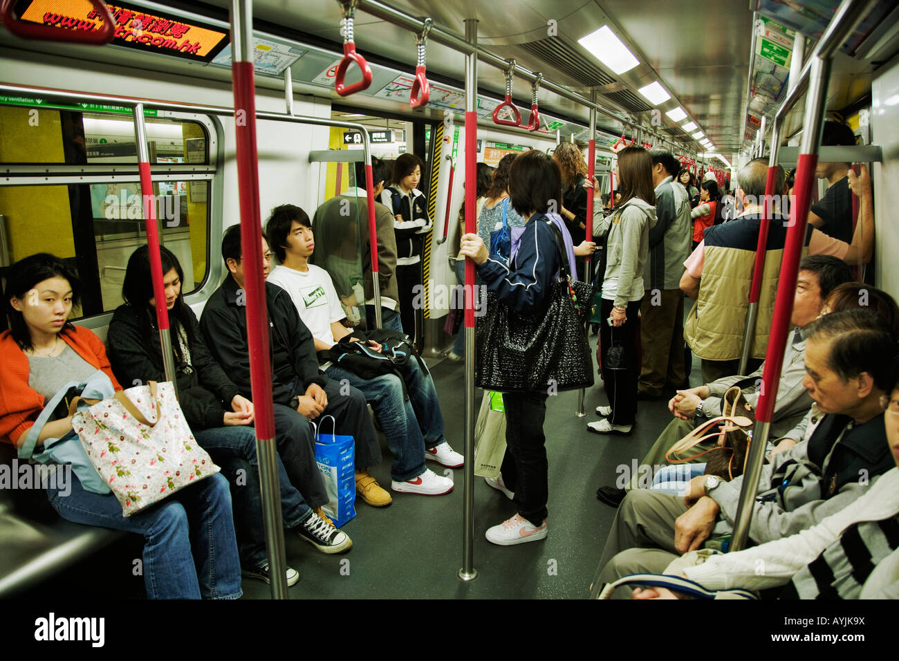 Congested view of people using a Hong Kong subway train Hong Kong Stock ...