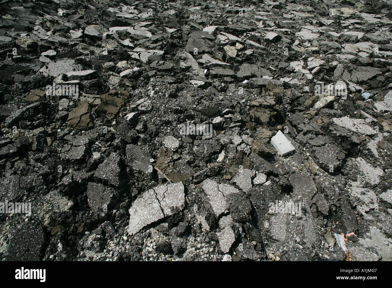 Broken tarmac on a parcel of land due for development, Essex, England ...