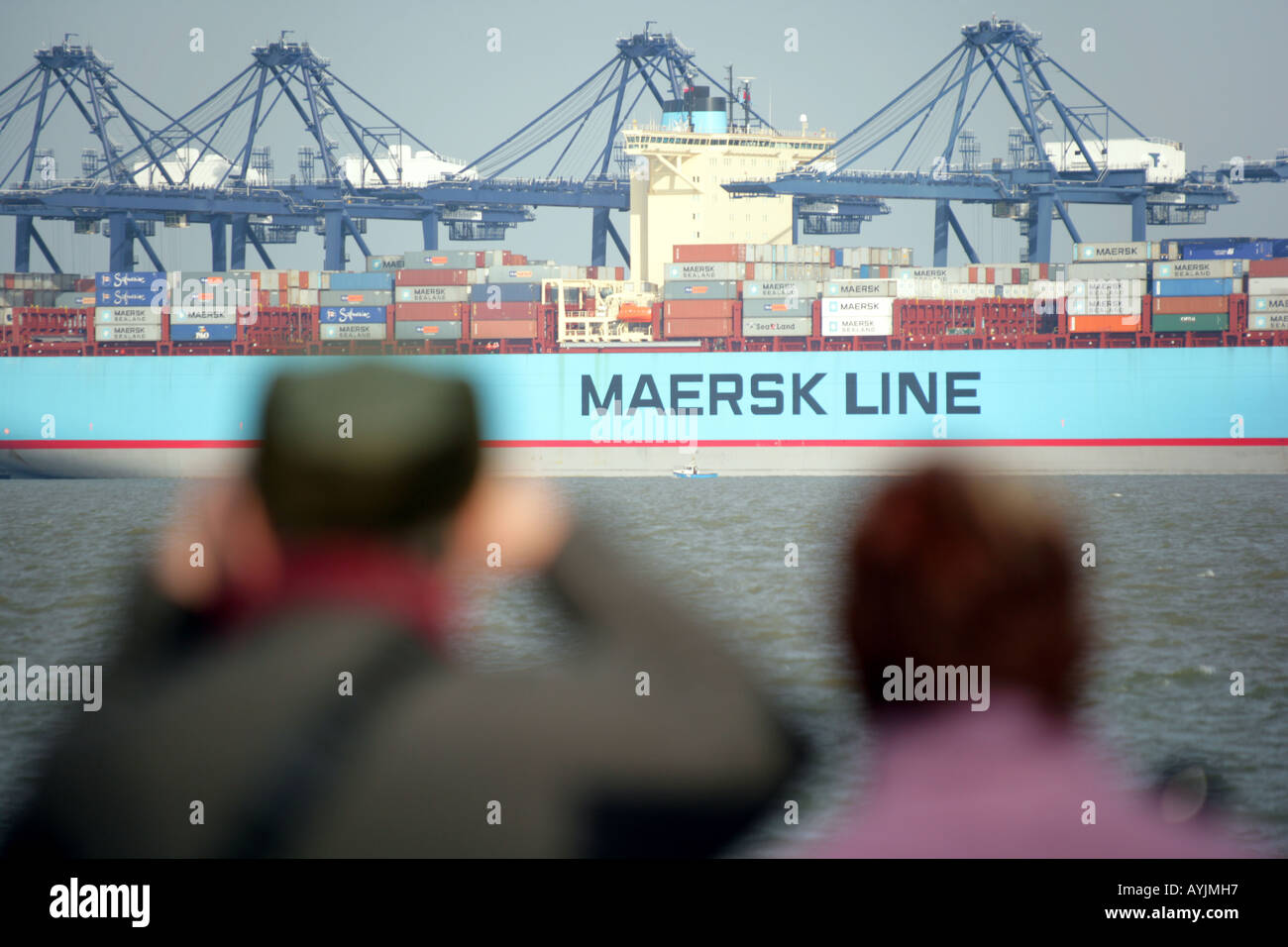 Local residents looking at the Emma Maersk, the largest container ship ...