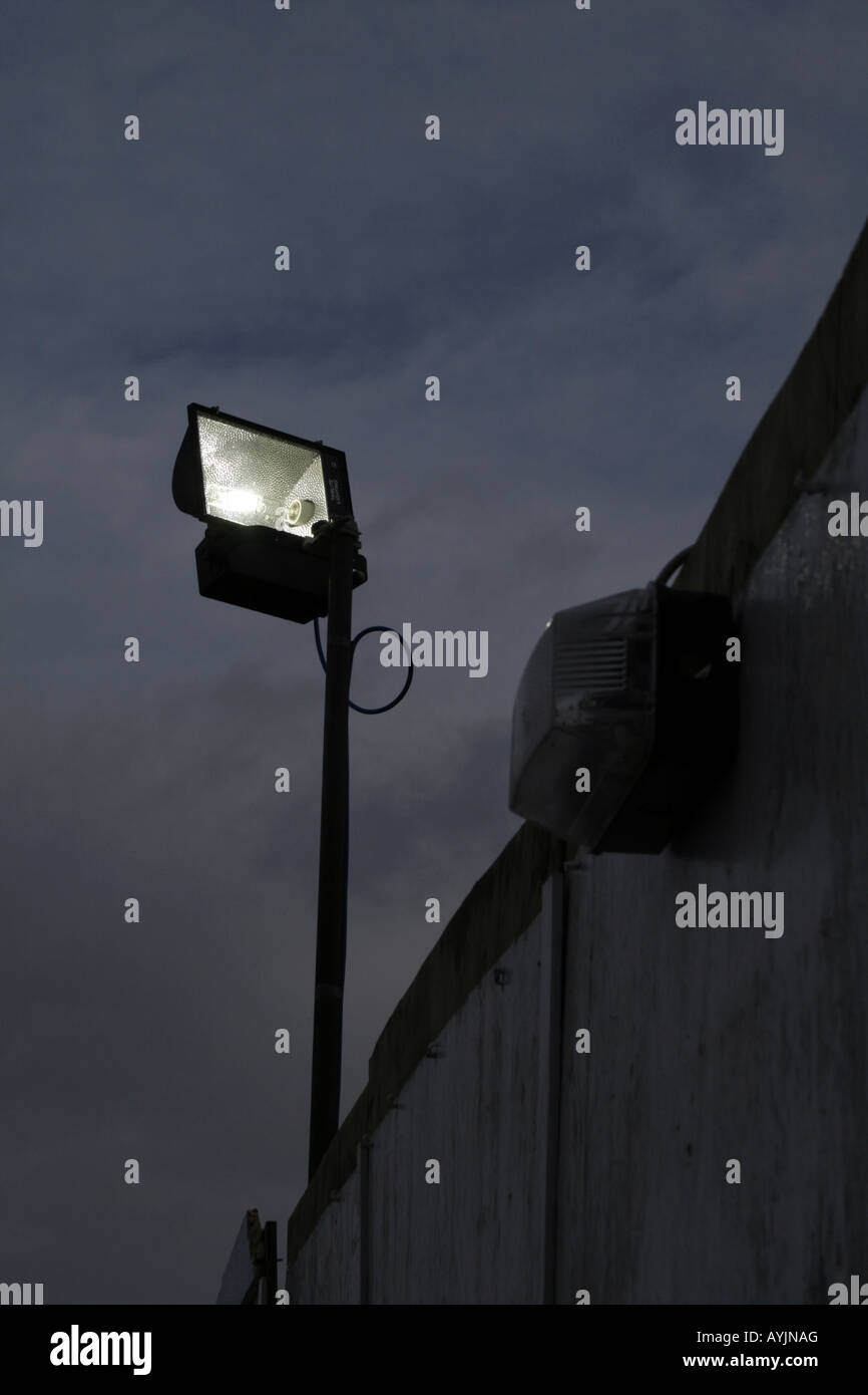 one security light on building site at night Stock Photo - Alamy