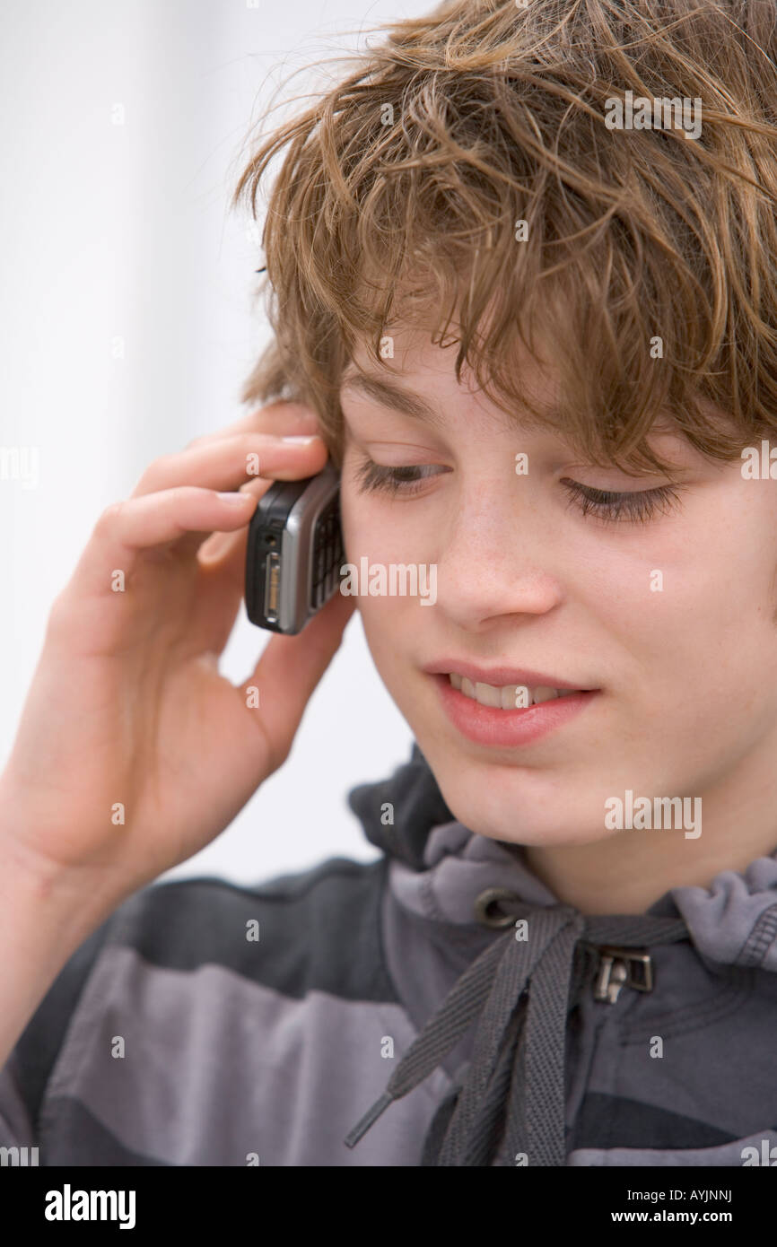 Portrait of a teenage boy with a mobile phone Stock Photo - Alamy