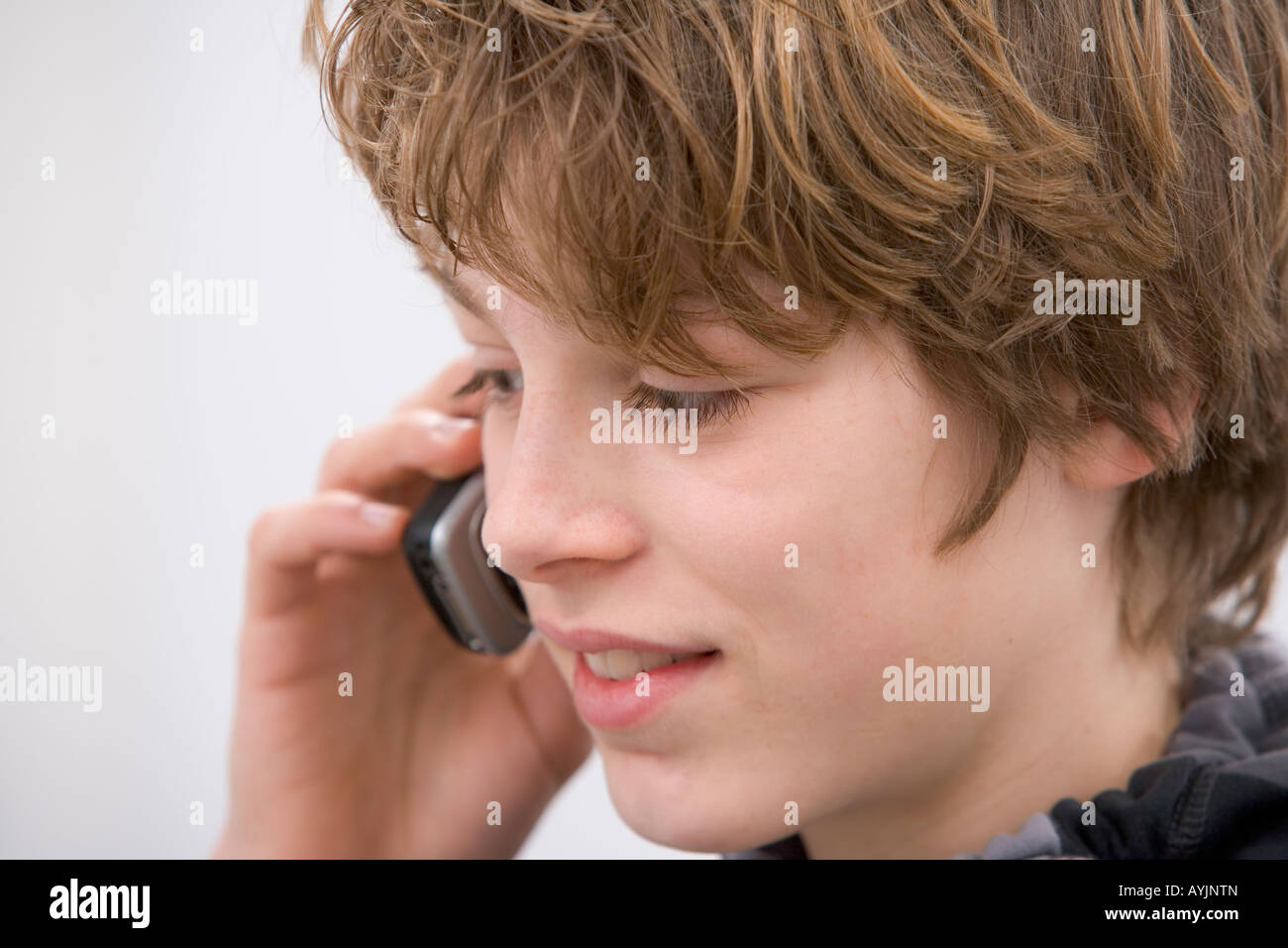 Portrait of a teenage boy with a mobile phone Stock Photo - Alamy