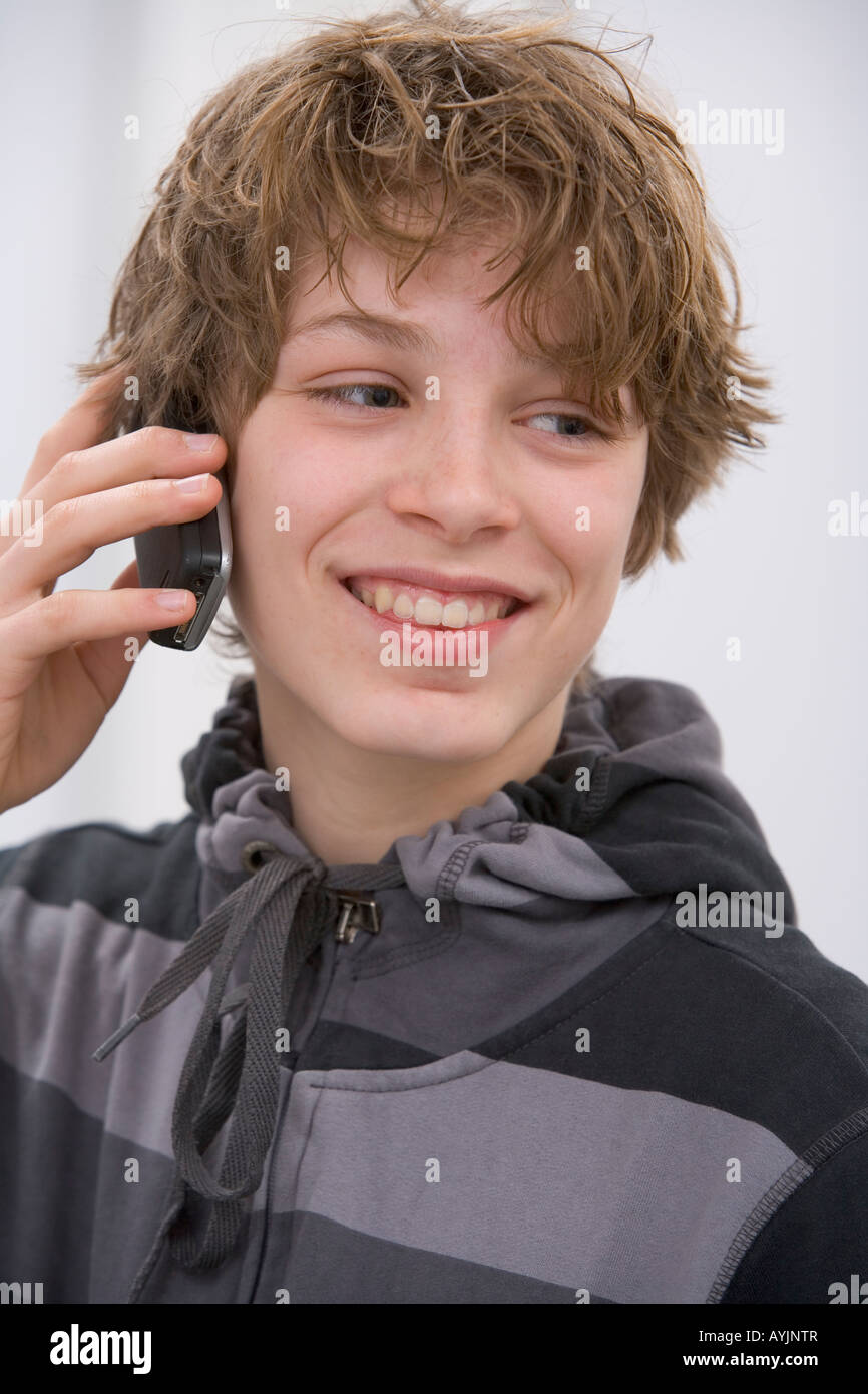 Portrait of a teenage boy with a mobile phone Stock Photo - Alamy