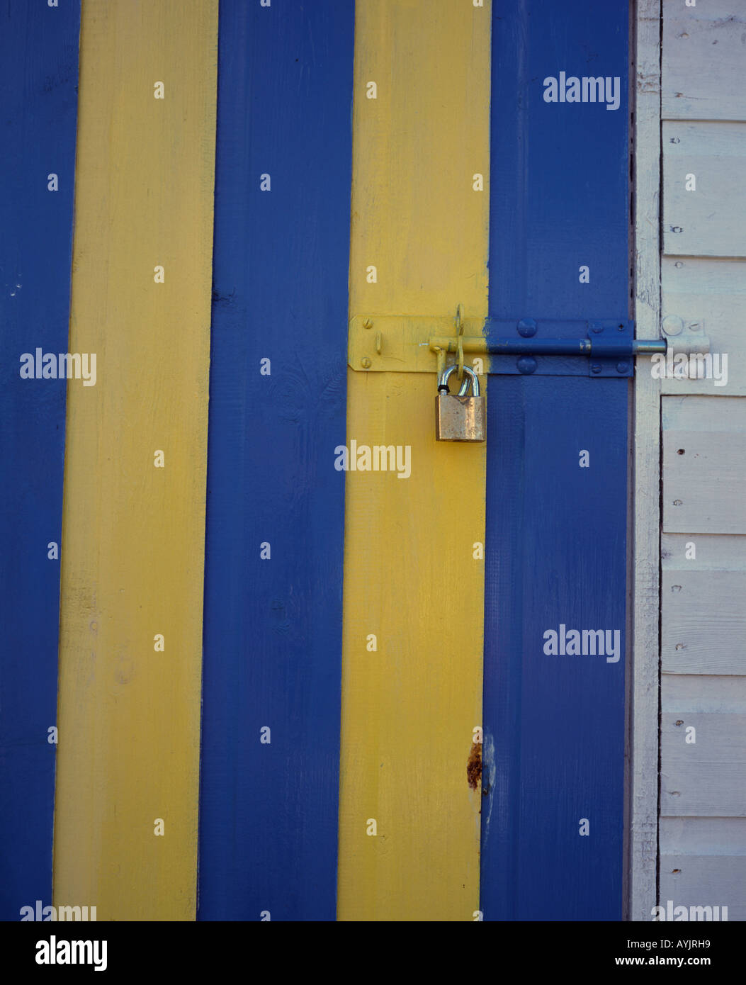 Yellow and blue striped door of a beach hut Broadsands Beach, near ...