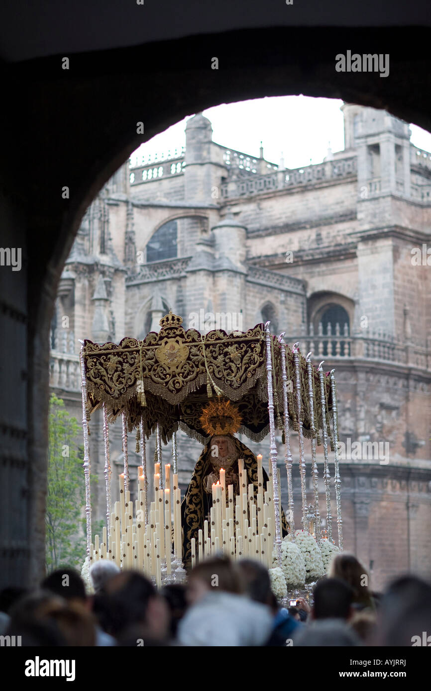 Framed view of a Holy Week float with the Virgin image in front of ...