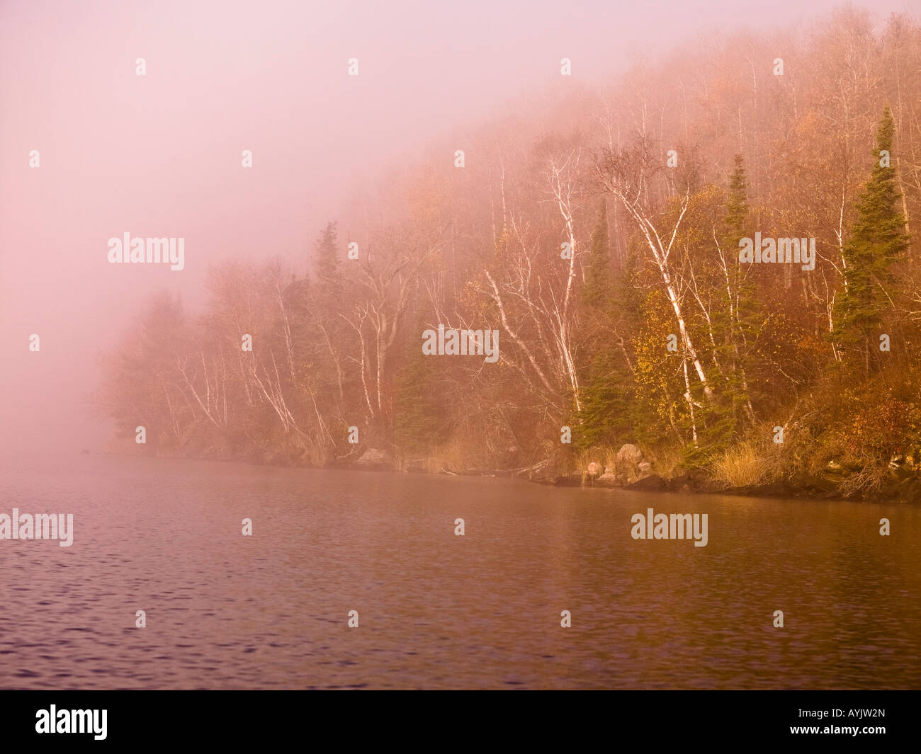 Fog over a lake Stock Photo - Alamy