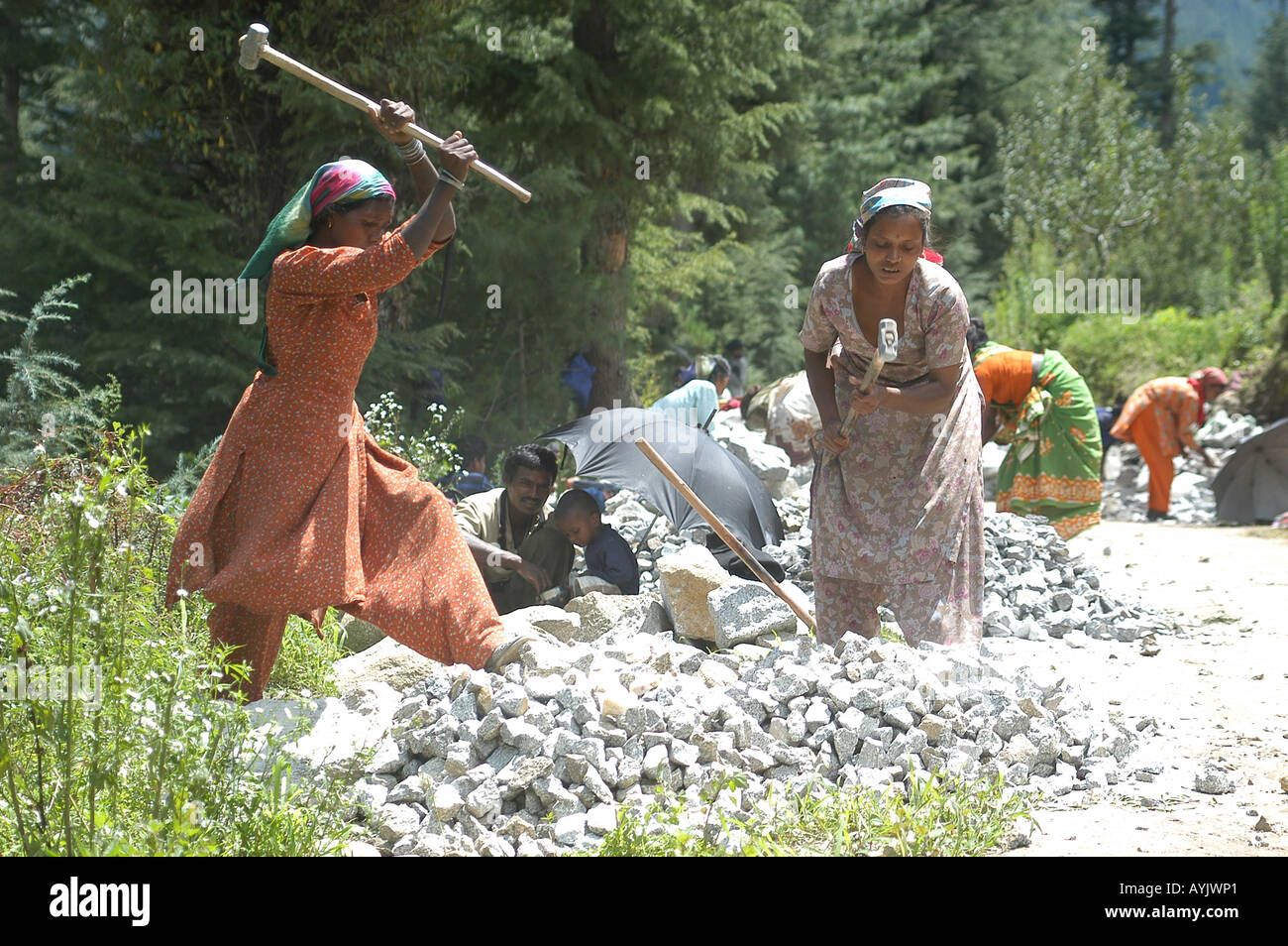 women at work at a stone quarry breaking rocks into gravel Stock Photo ...