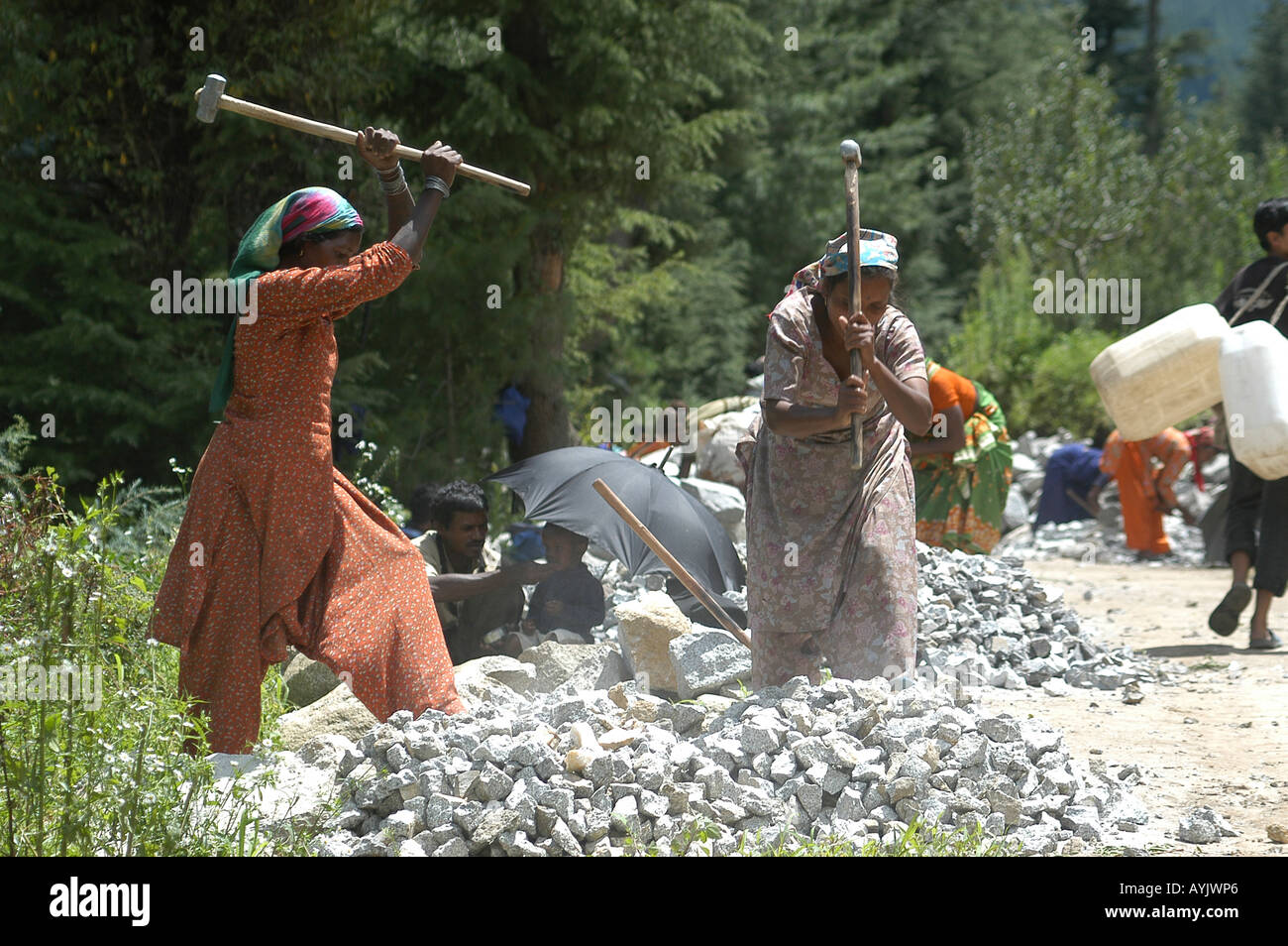 women at work at a stone quarry breaking rocks into gravel Stock Photo ...