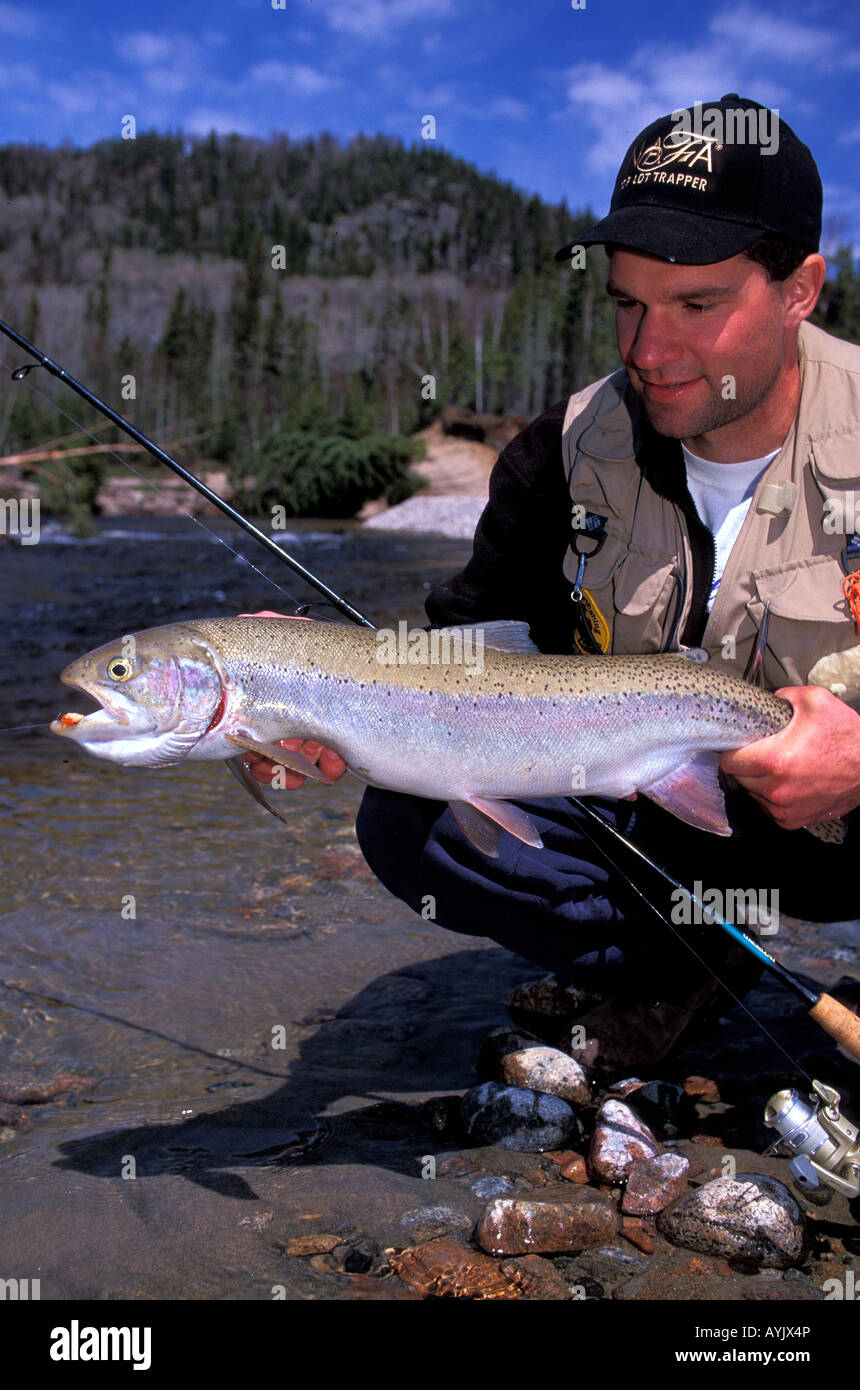Fisherman with steelhead. rainbow trout Stock Photo - Alamy