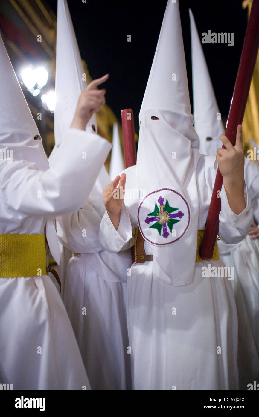 Young penitents talking, Holy Week, Seville, Spain Stock Photo - Alamy