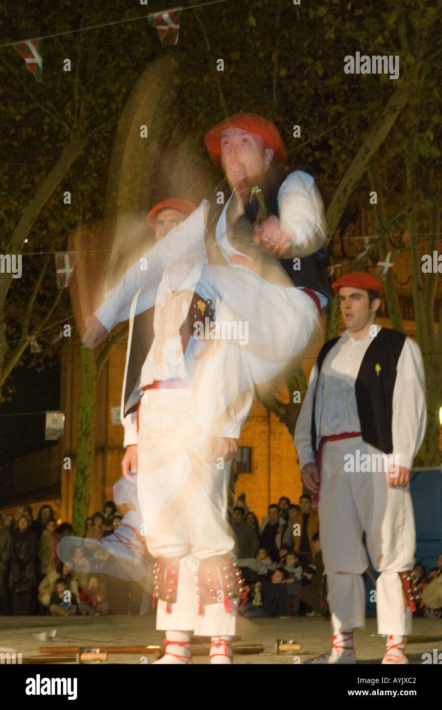A male Basque dancer kicks into the air during the performance of a ...
