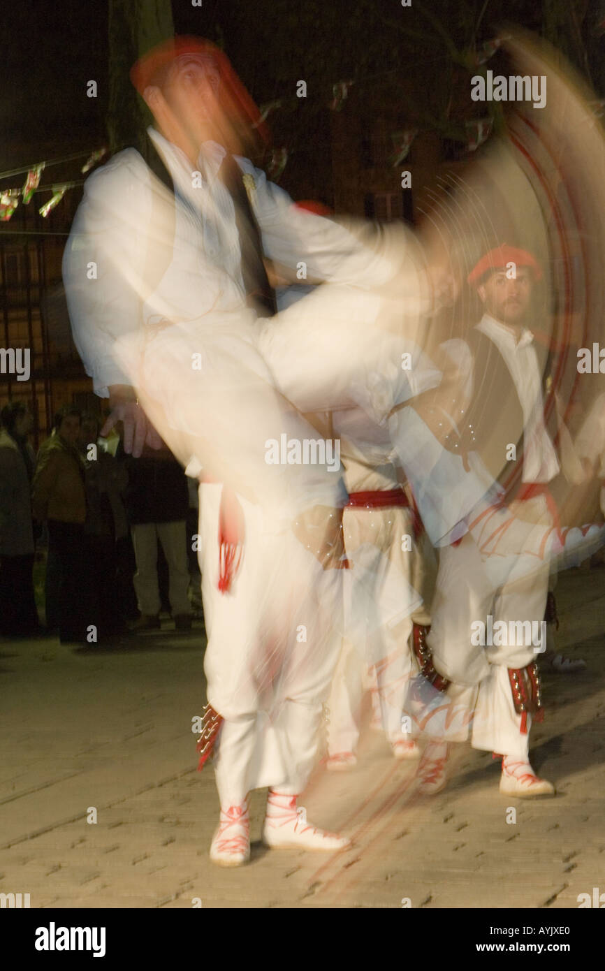 Male Basque dancer kicks into the air during the performance of a ...