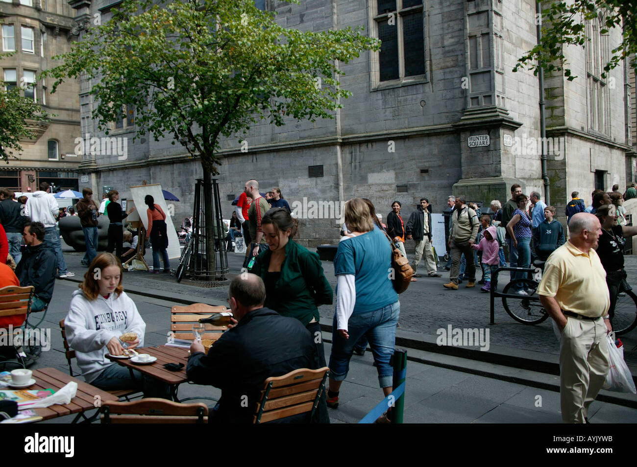 Waitress from restaurant pouring wine for customer, during Edinburgh ...