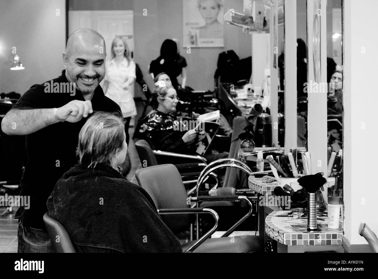 stylists cut hair in busy London Salon Stock Photo - Alamy