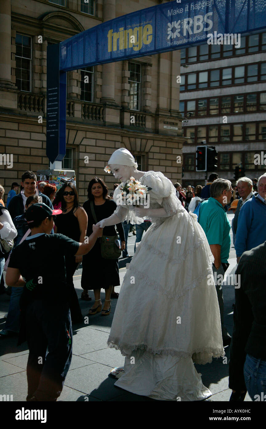 Human Statue Street Performer taking the hand of passerby, Edinburgh ...