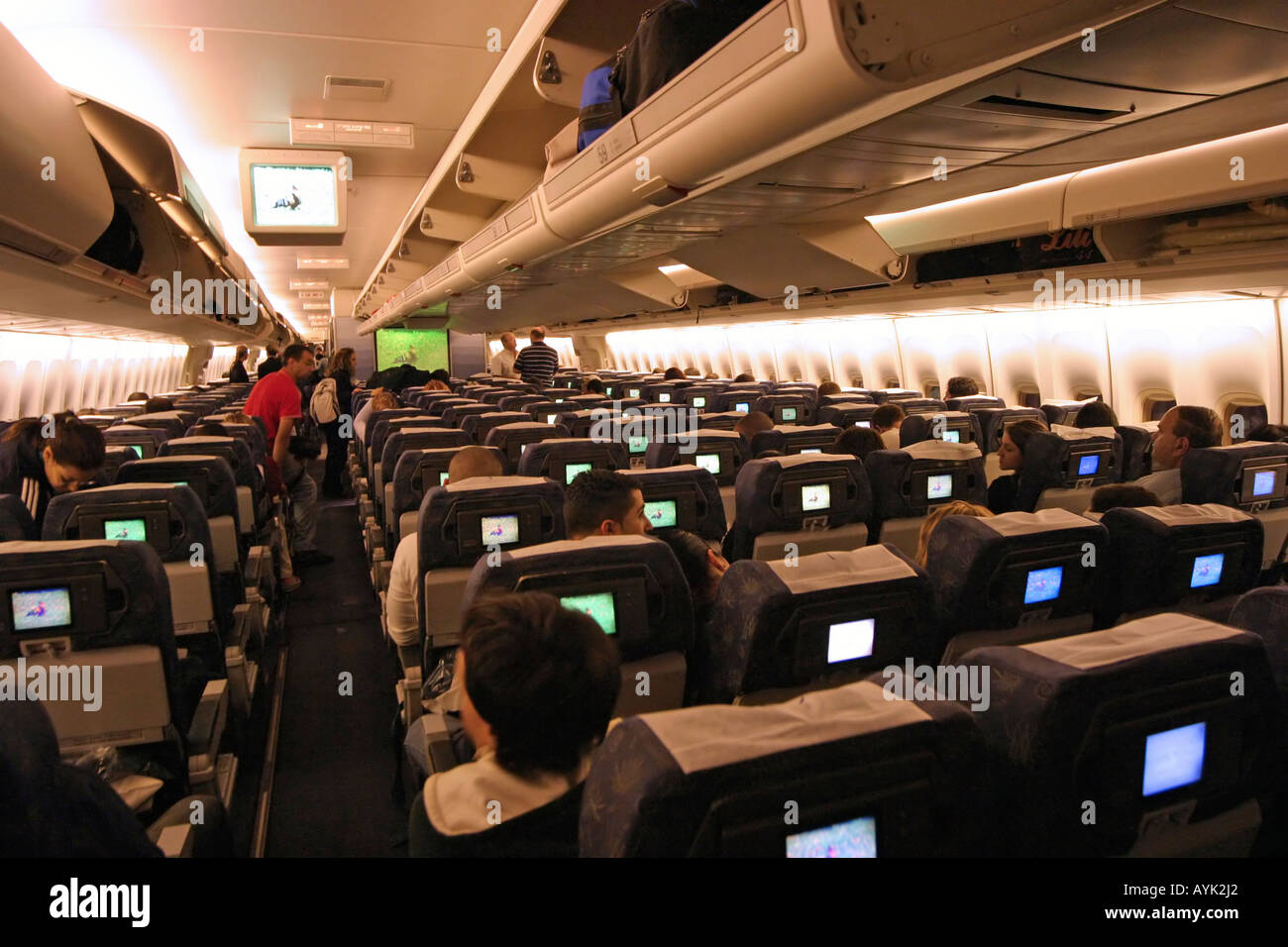 on board a commercial flight Economy class Stock Photo - Alamy