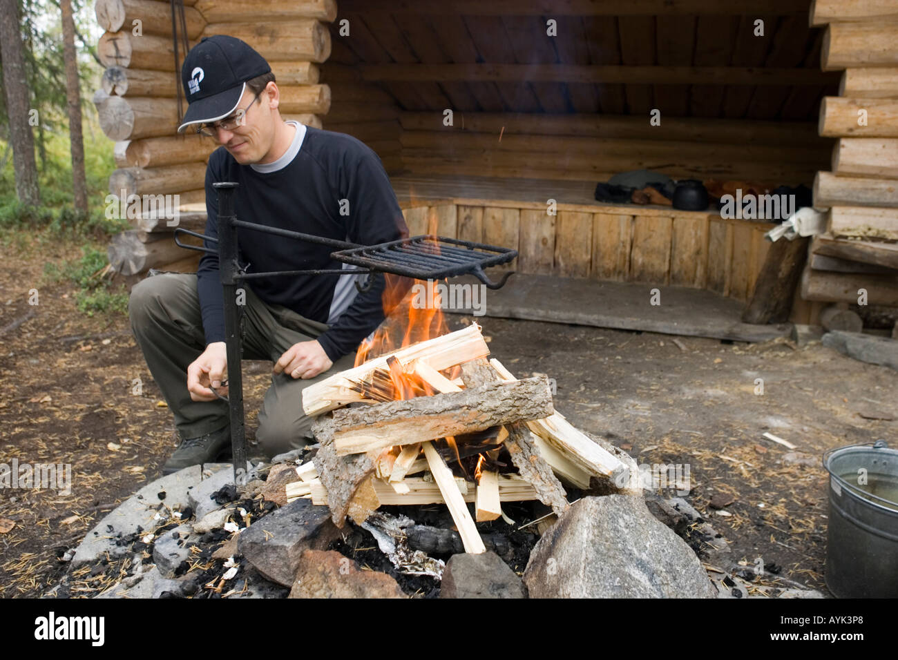 Lighting campfire in hiking area Arctic Circle Hiking Area near ...