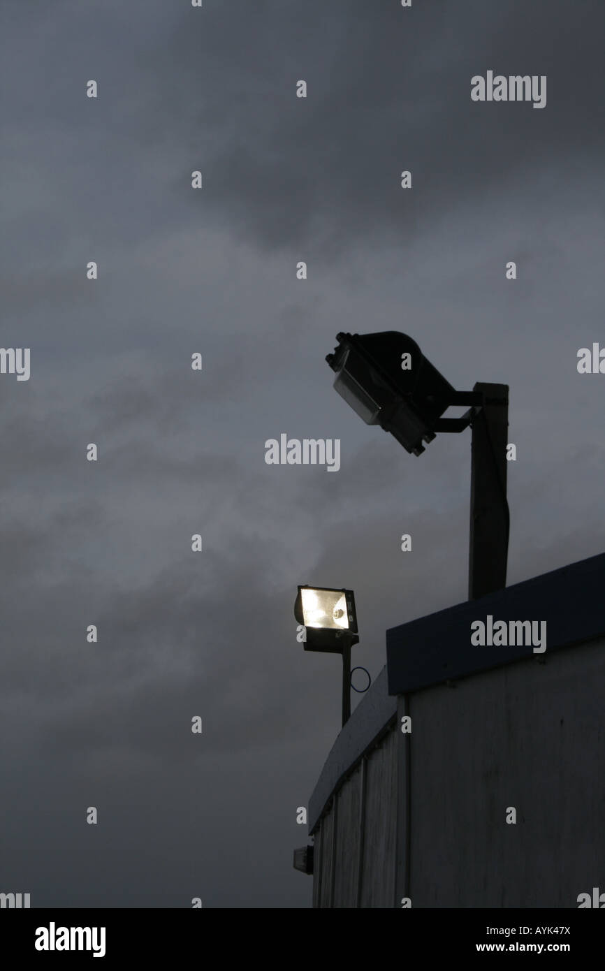 one security light on building site at night Stock Photo - Alamy