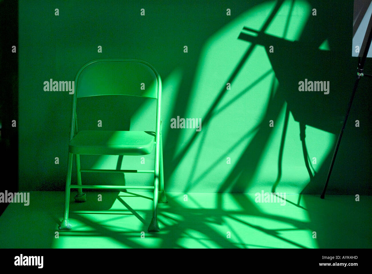 Single folding chair illustrating concept of being isolated alone ...